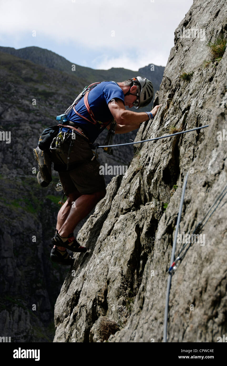 A climber leading Spiral Stairs on Dinas Cromlech Stock Photo - Alamy