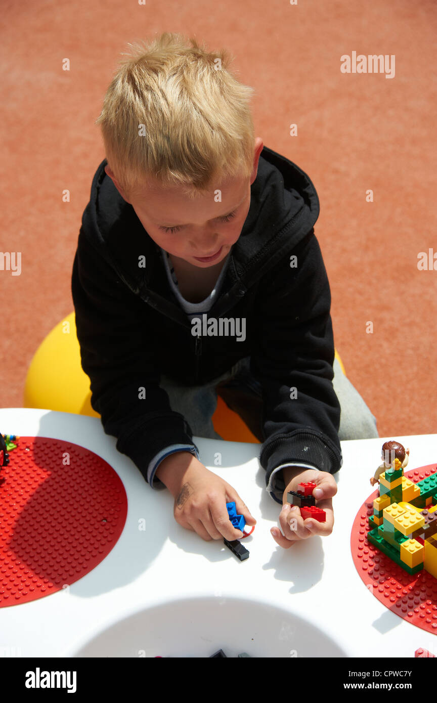 Child boy playing with building bricks Stock Photo - Alamy
