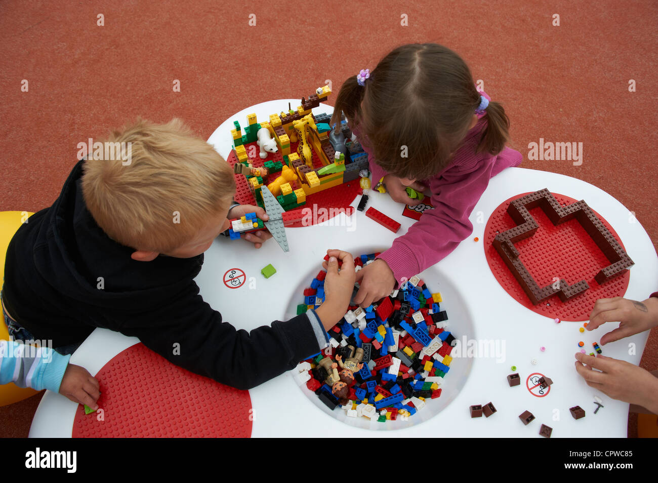 Children boy and girl playing with building bricks Stock Photo - Alamy
