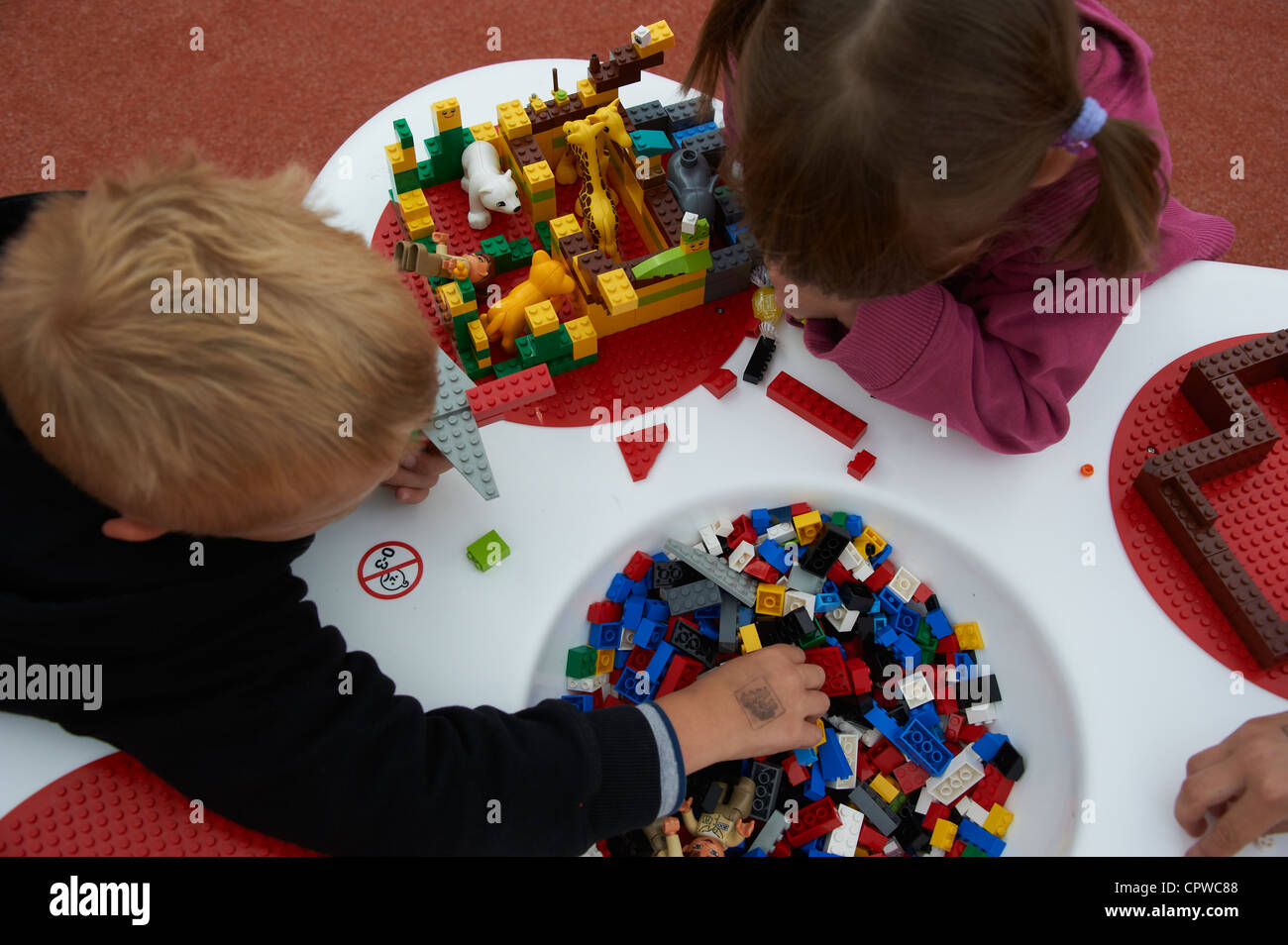 Children boy and girl playing with building bricks Stock Photo - Alamy