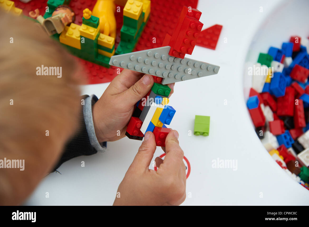 Child boy playing with building bricks Stock Photo - Alamy