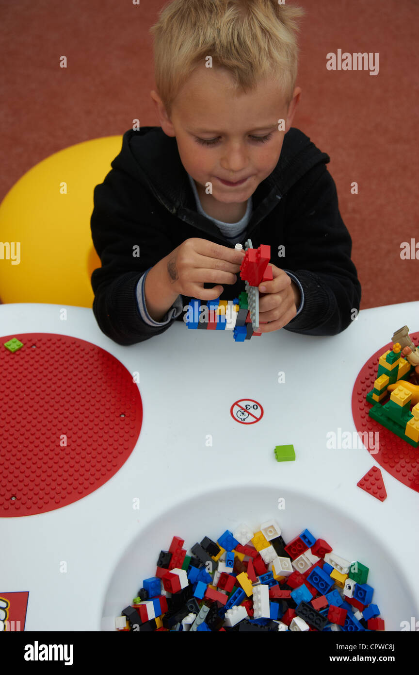 Child boy playing with building bricks Stock Photo - Alamy