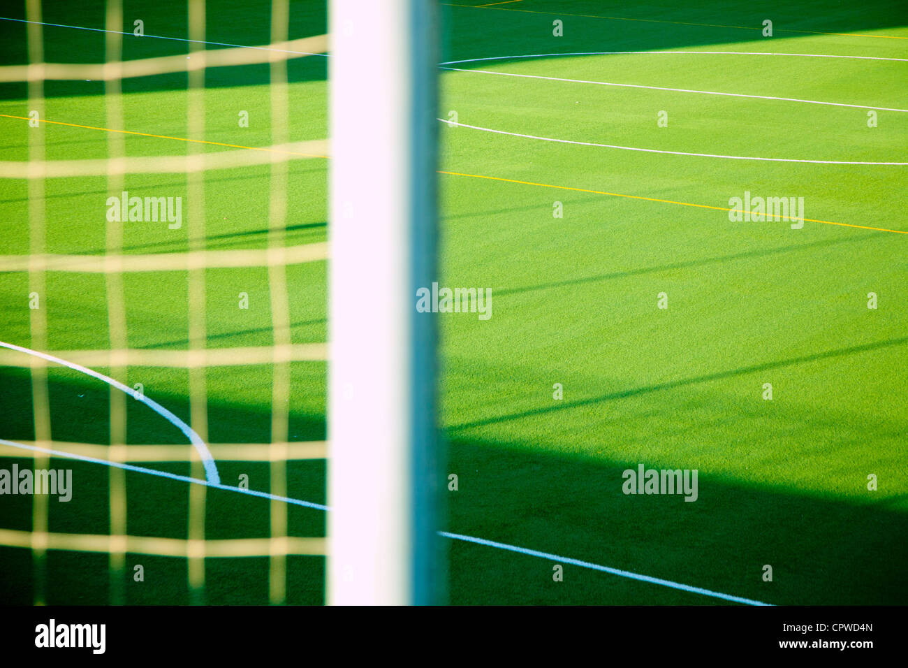 Green soccer net detail with sport grass field background Stock Photo ...