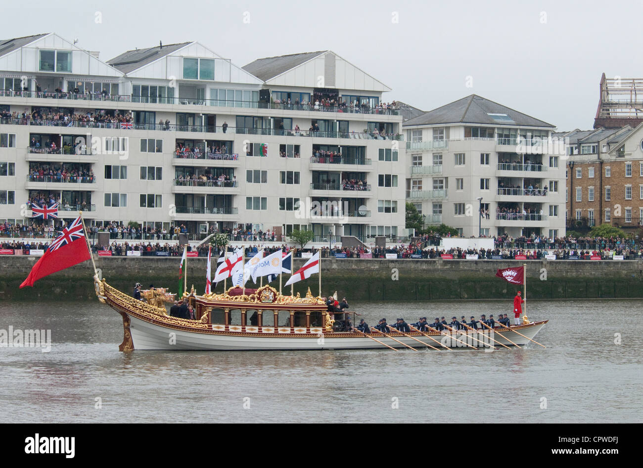 Royal Row barge Gloriana with flags and celebrity rowers on the Thames ...