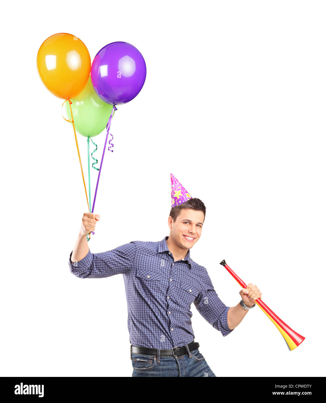 Portrait of a happy male holding balloons and a horn isolated on white ...