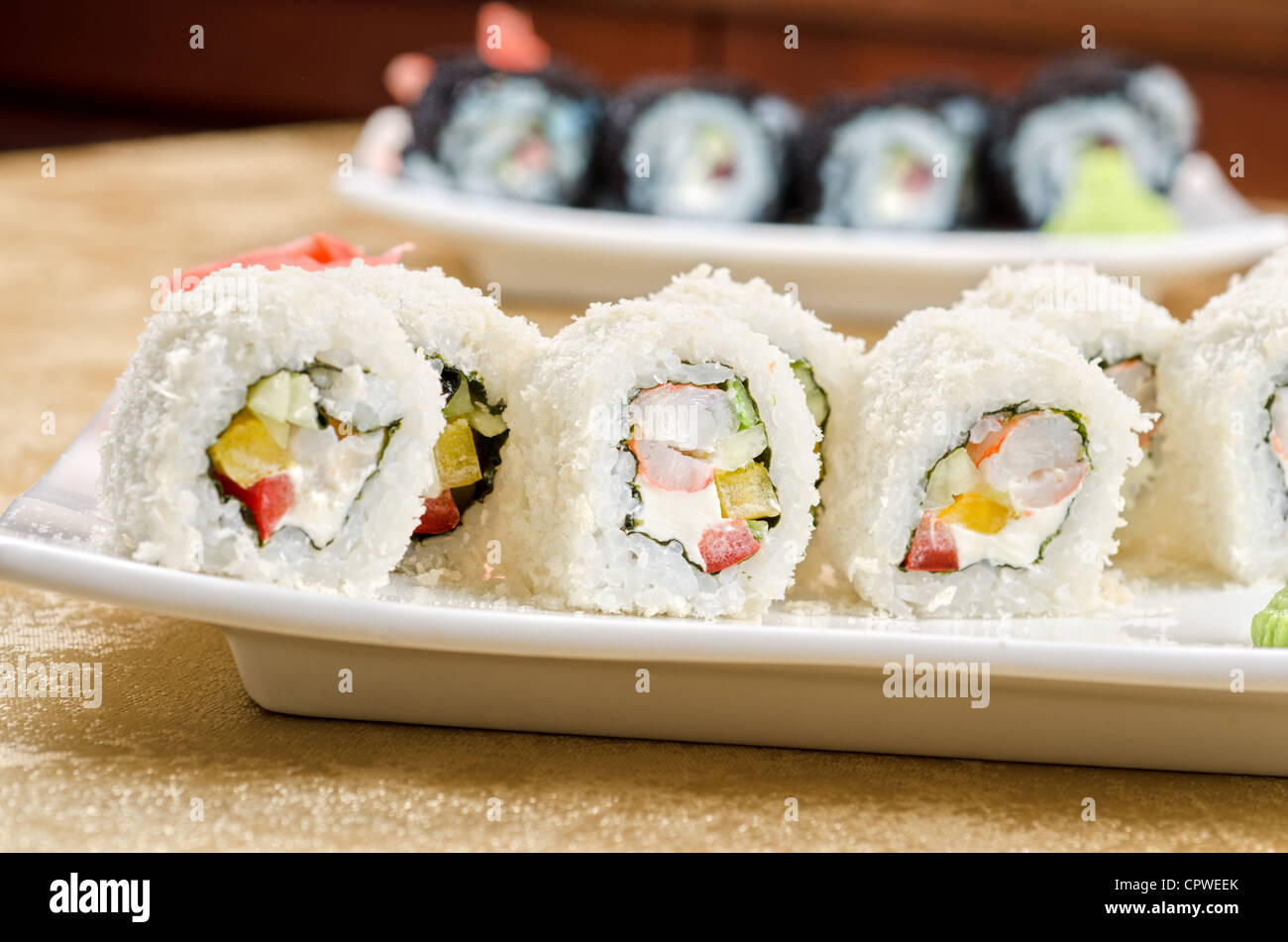 sushi roll of shrimp, cucumber, pepper and sauce, closeup Stock Photo ...