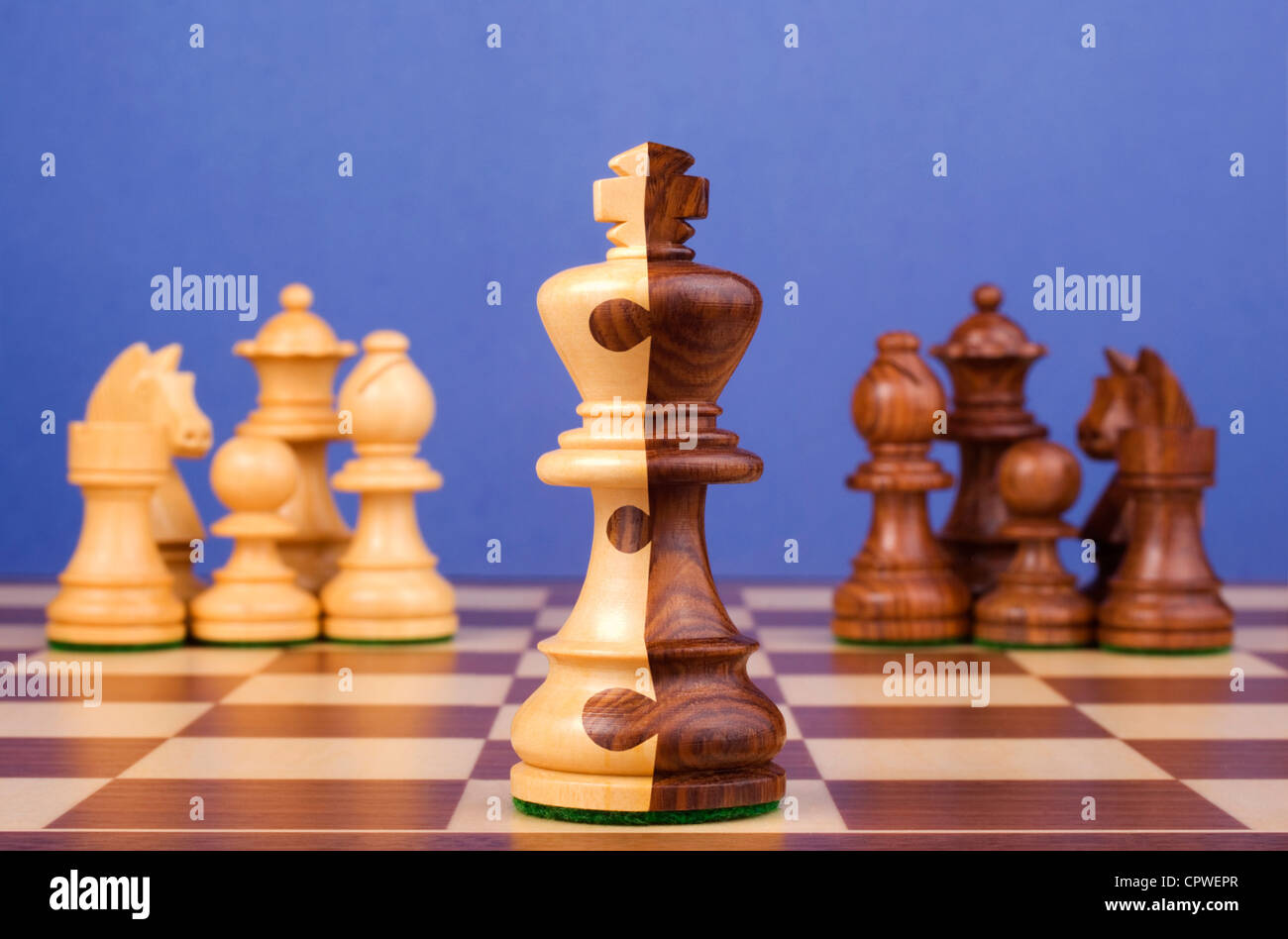 Chess Board with teams of black and white pieces, king is half and half ...