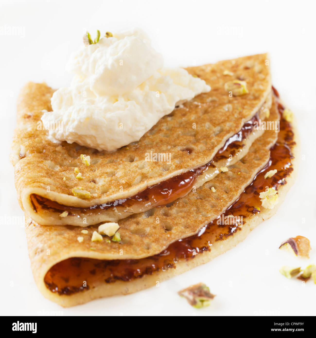 Commercially produced crepe with strawberry jam and whipped cream ...