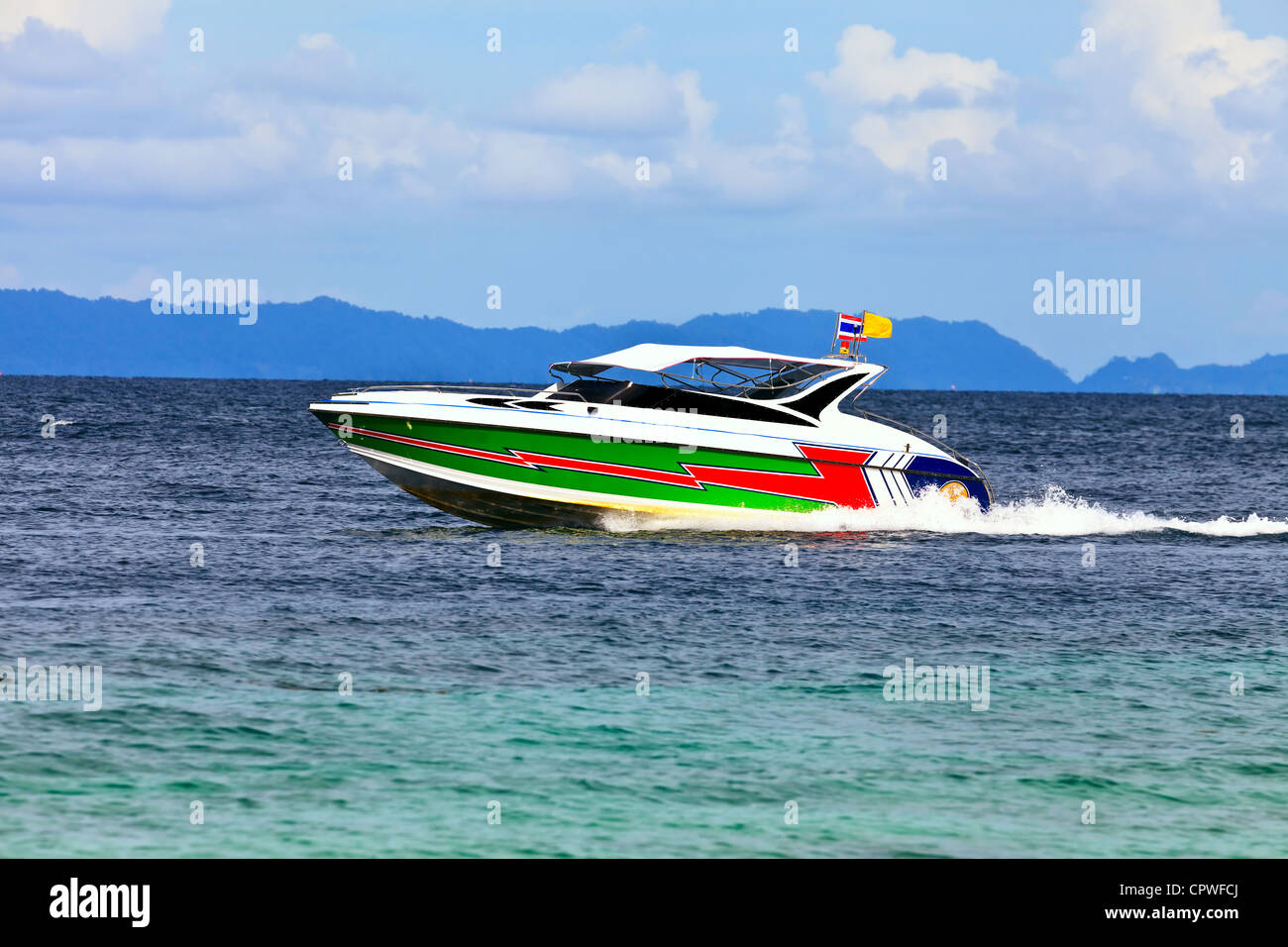 Colorful speed boat glide on sea waves Stock Photo - Alamy