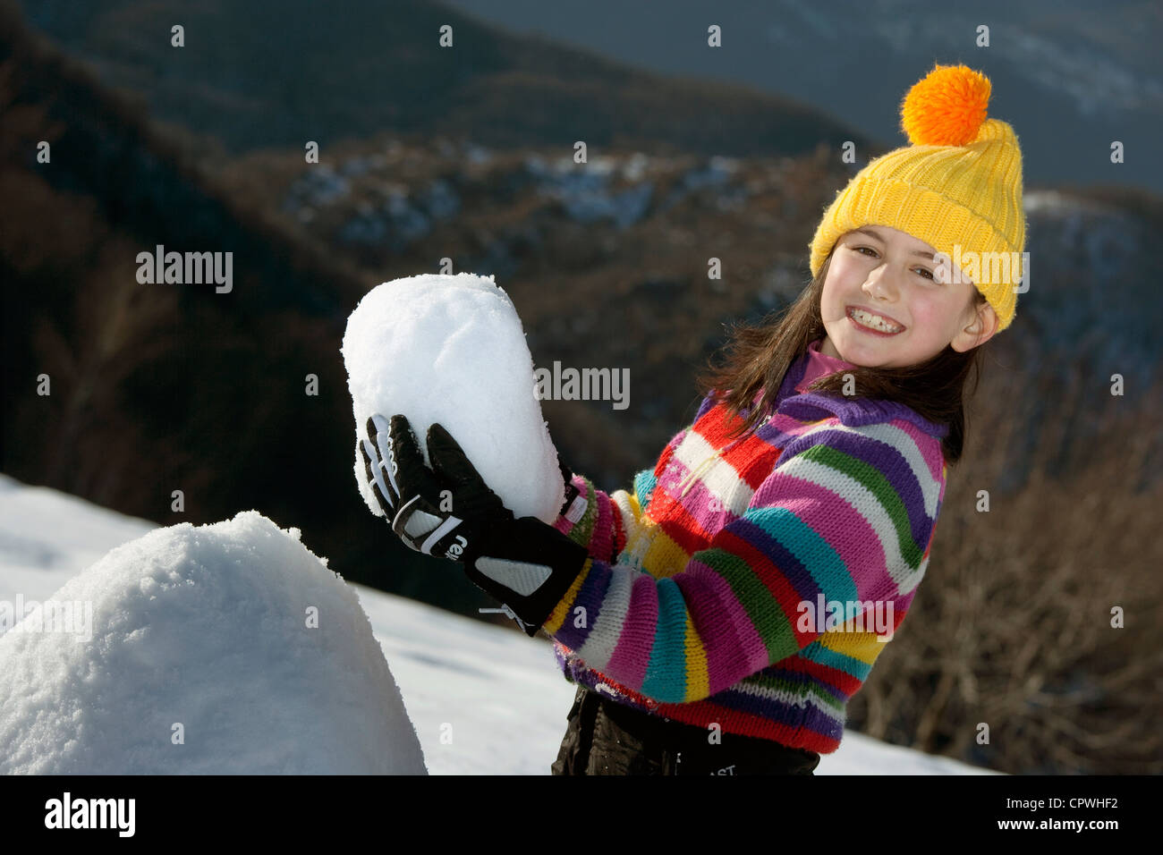 little girl with snowball Stock Photo - Alamy