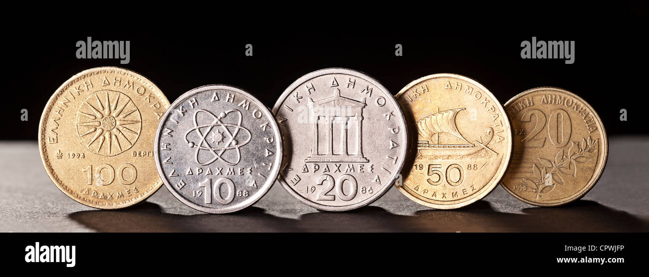 Ancient Greek drachmas stand in a row next to each other Stock Photo ...