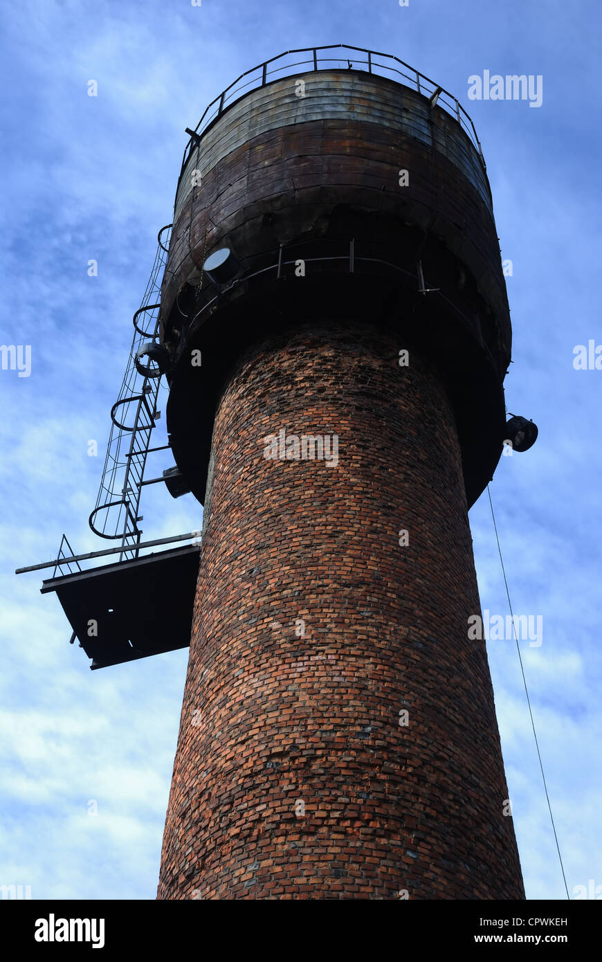 old brick water tower against blue sky Stock Photo - Alamy