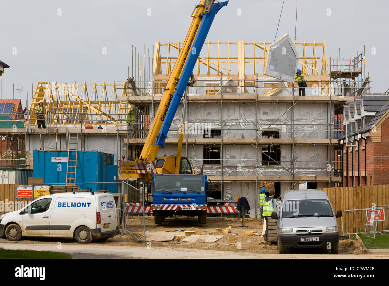 A crane working on a building site Stock Photo - Alamy