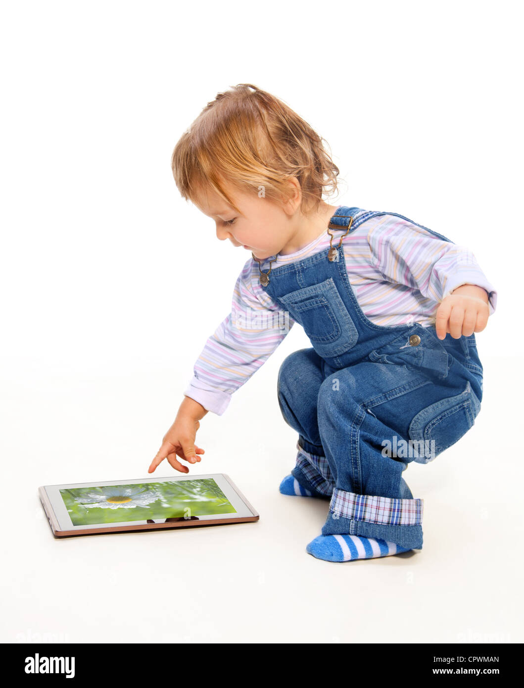 Young toddler touching tablet pc (image on the screen from my portfolio ...