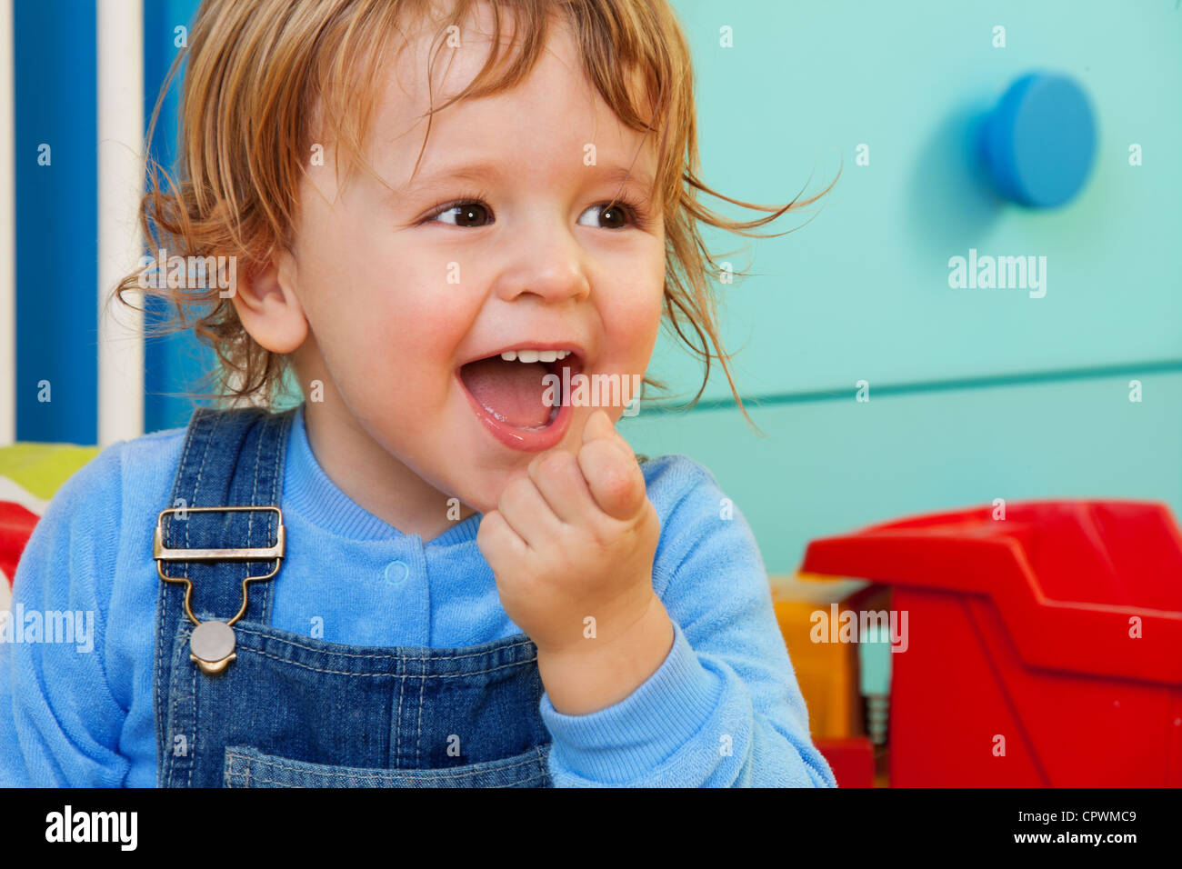 Laughing kid portrait with room on background Stock Photo - Alamy