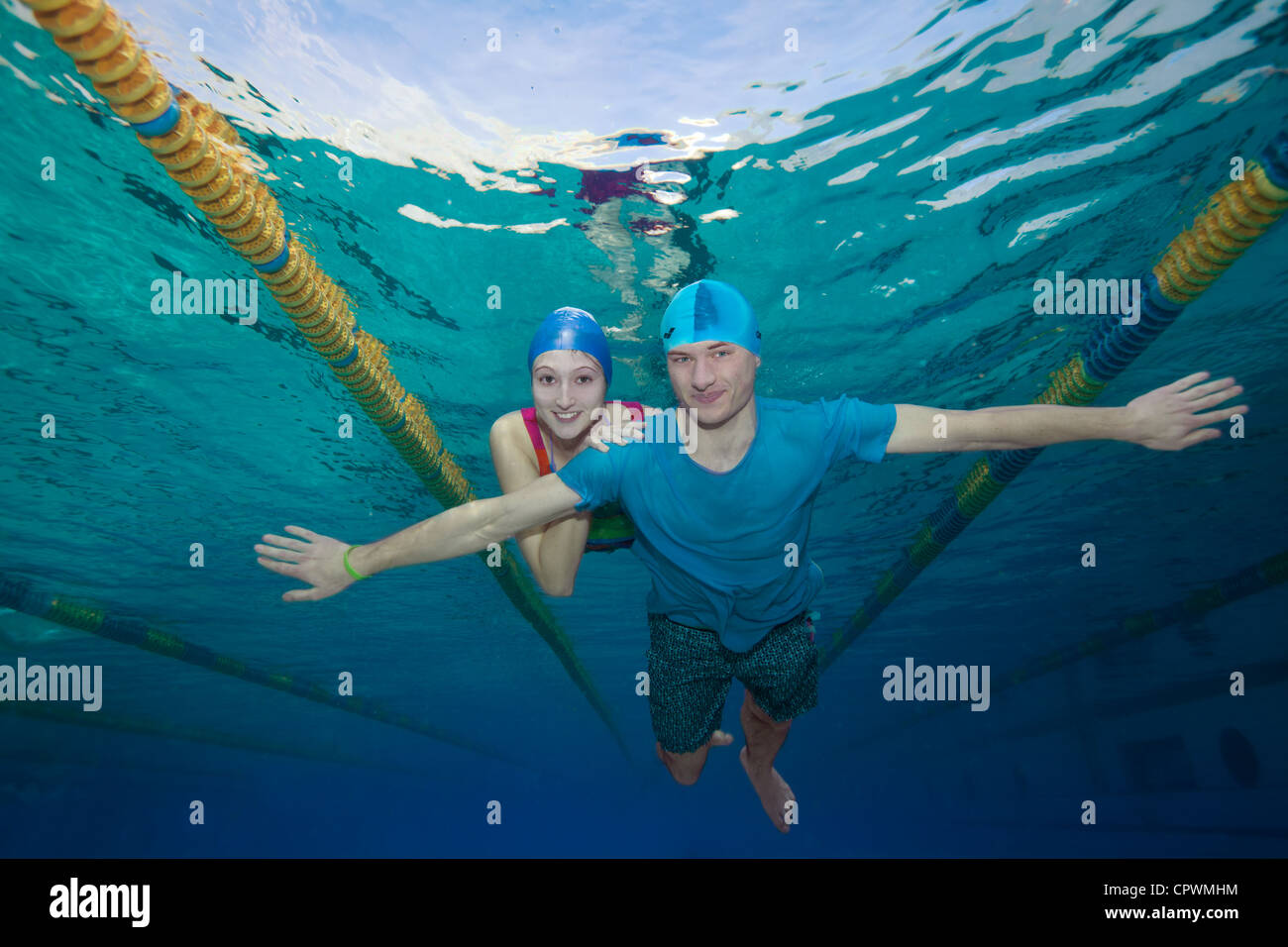Couple - underwater shoot - swimming together in casual clothes Stock ...