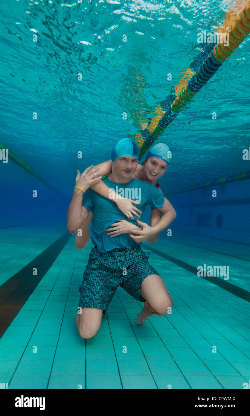 Girl hug boyfriend underwater in the pool Stock Photo - Alamy