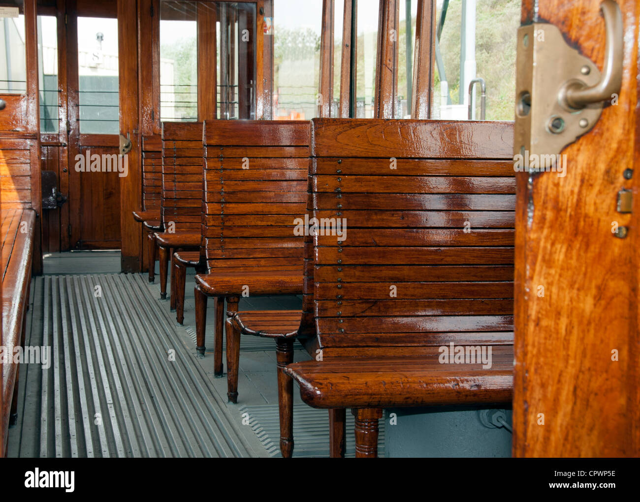 old wooden train interior with view trough the windows Stock Photo - Alamy