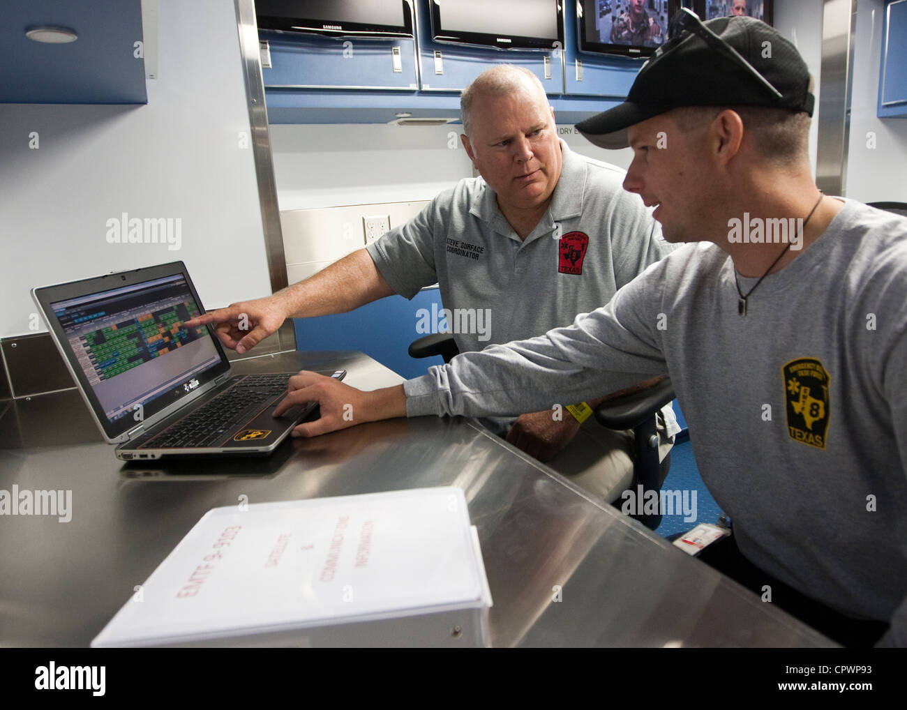 white male members of the Texas emergency medical task force talk ...