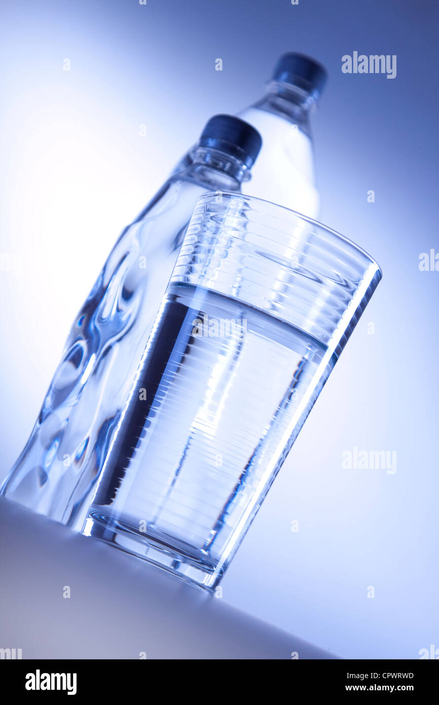 Drinking water in bootles and cup Stock Photo - Alamy