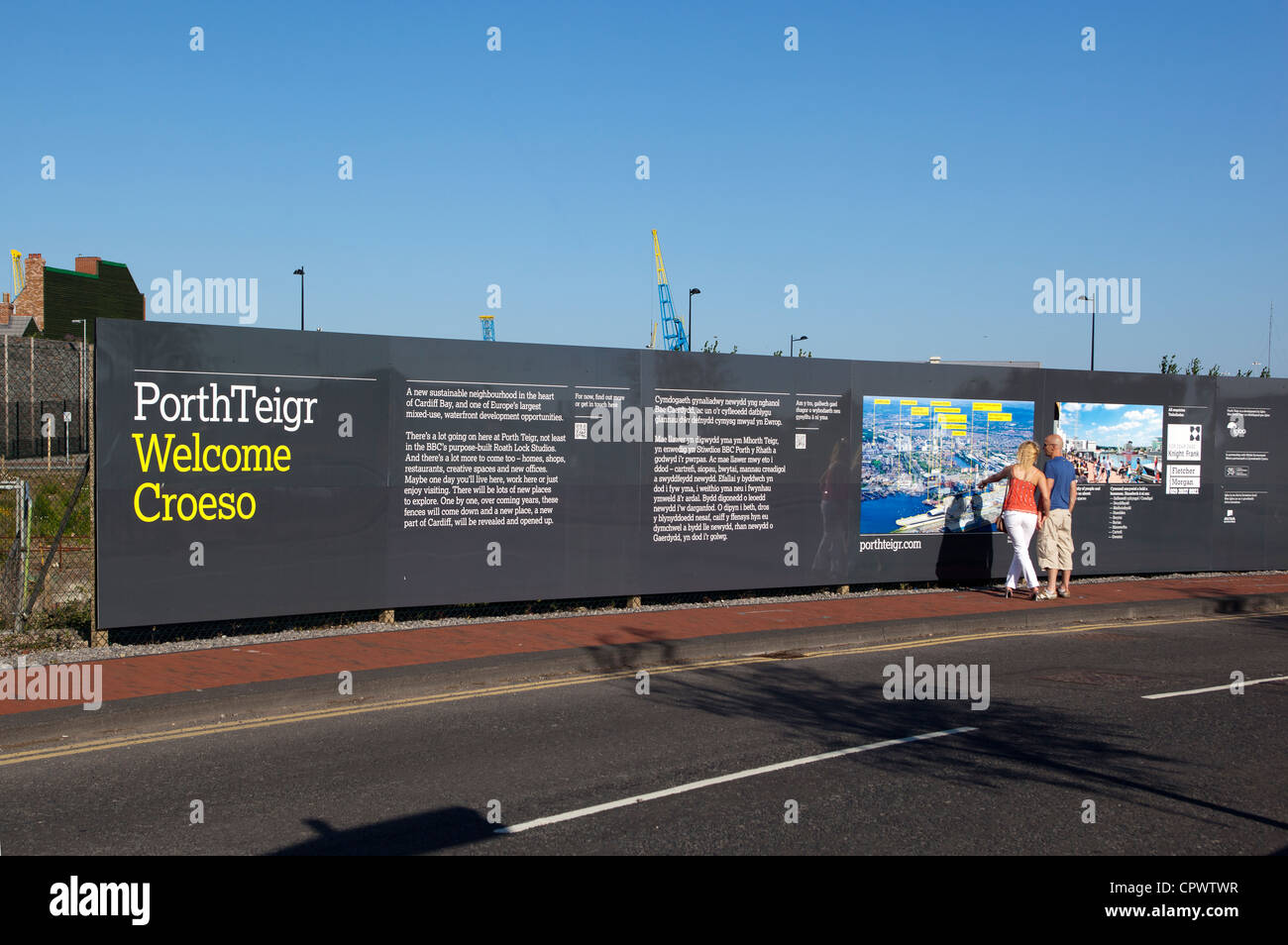 Welcome hoarding at Porth Teigr Cardiff bay Stock Photo - Alamy