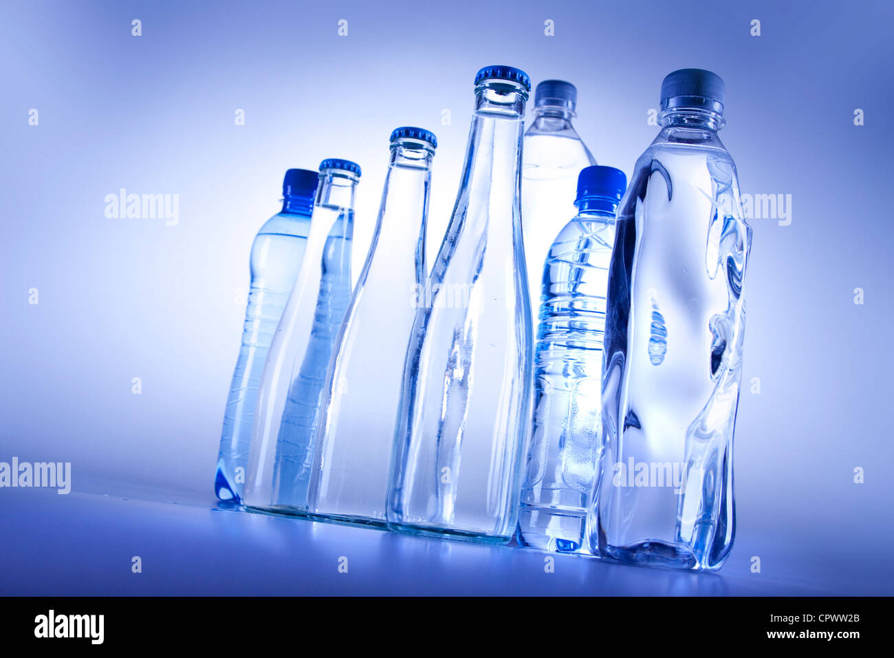 Drinking water in bootles and cup Stock Photo - Alamy