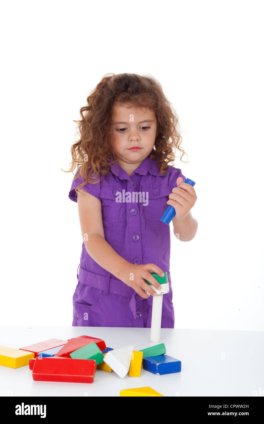 kindergarten child playing with building bricks or blocks Stock Photo ...