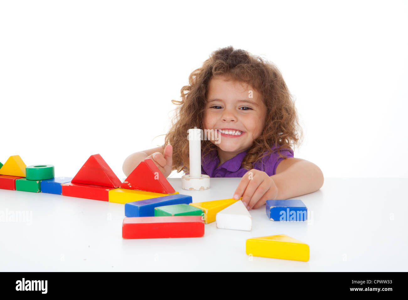 young happy girl child playing with building bricks or blocks Stock ...