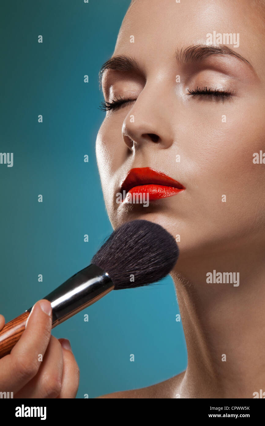 Making up the models face - professional makeup artist working Stock ...