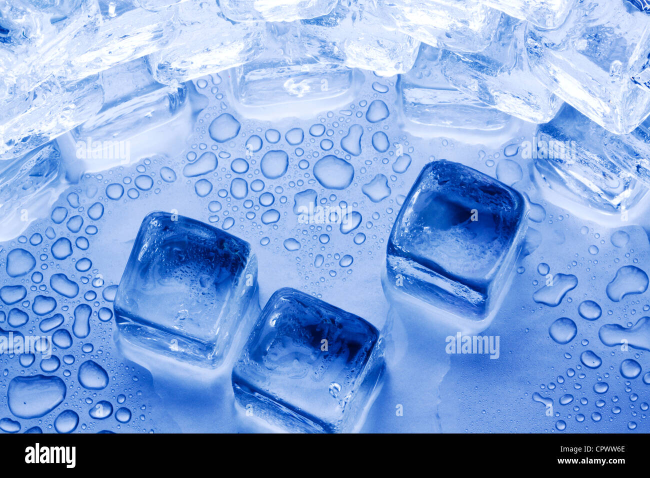 ice cubes in blue background Stock Photo - Alamy