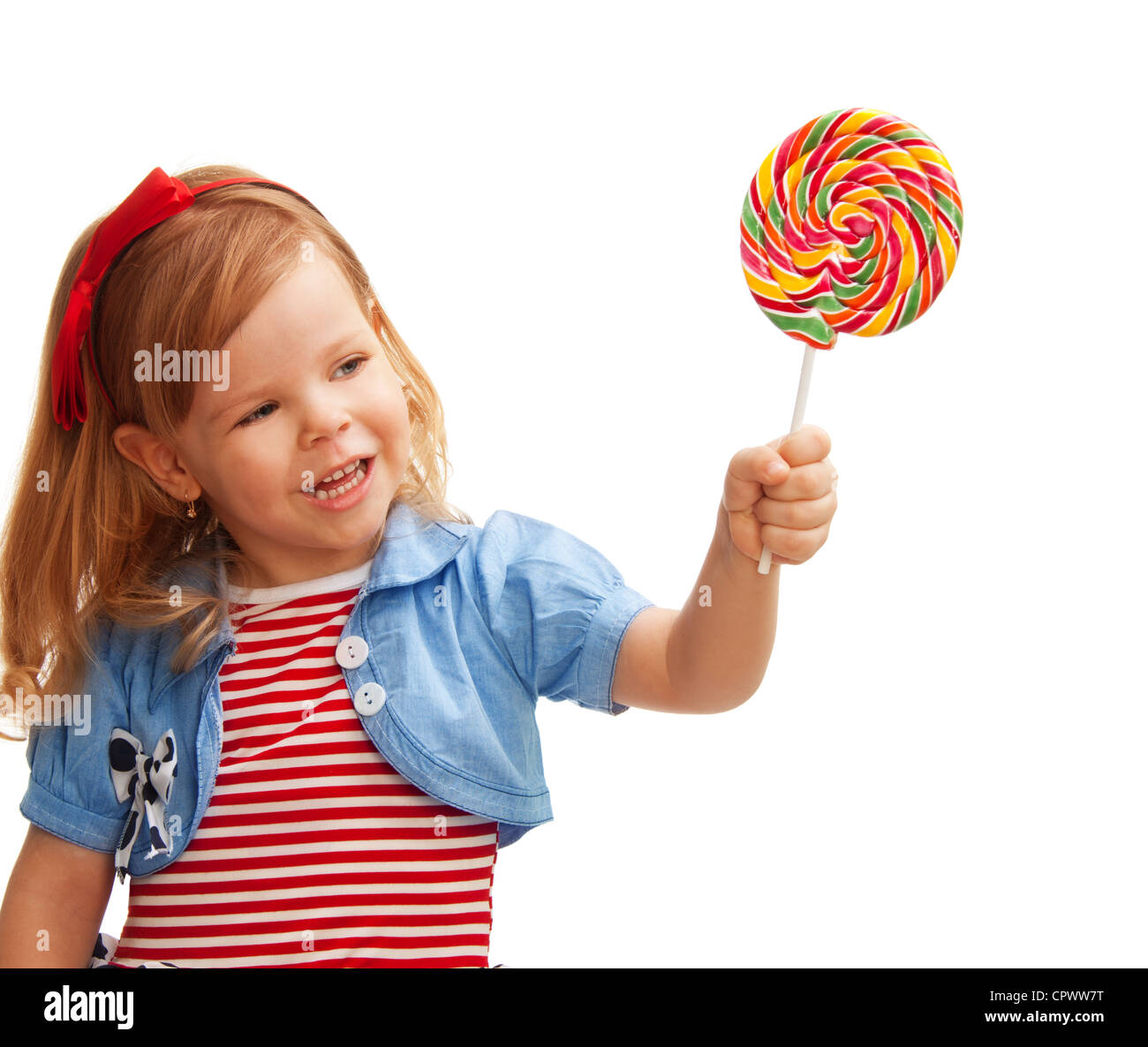 Little girl holds big lollipop in her hand Stock Photo - Alamy