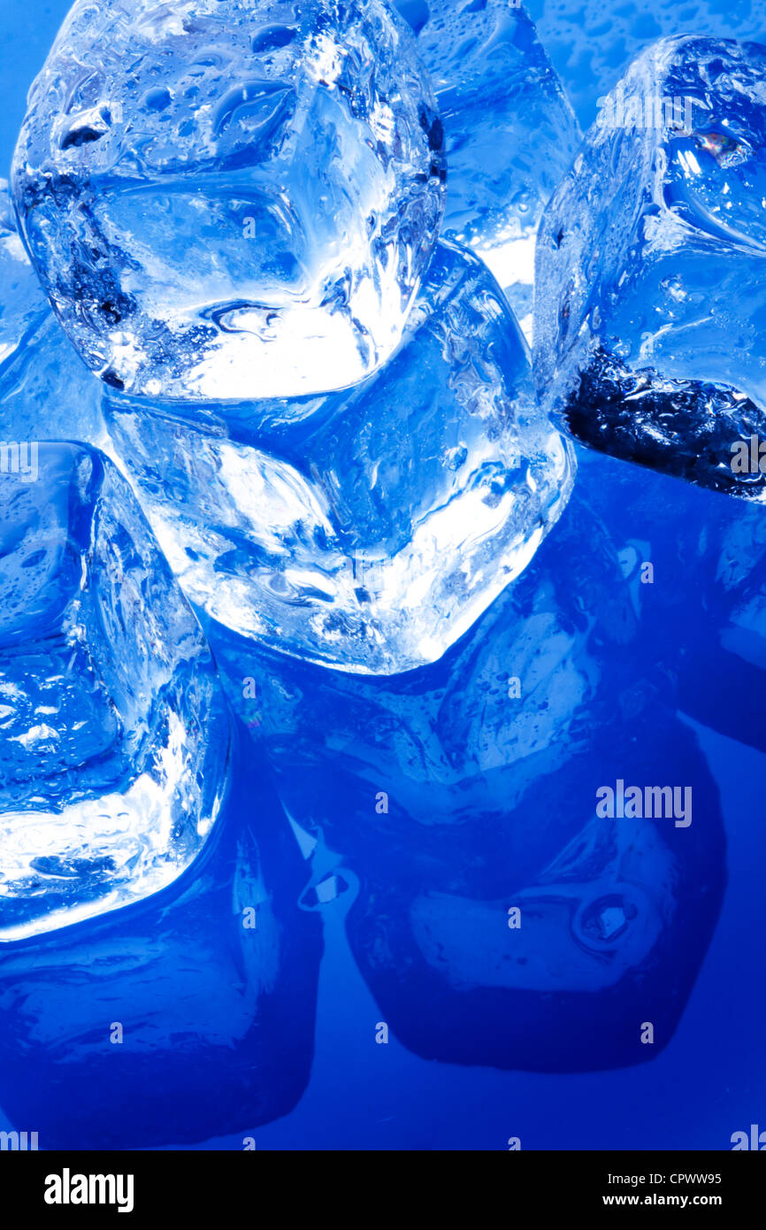 ice cubes in blue background Stock Photo - Alamy