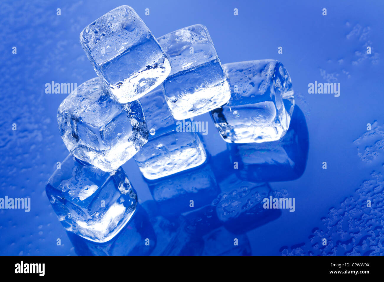ice cubes in blue background Stock Photo - Alamy