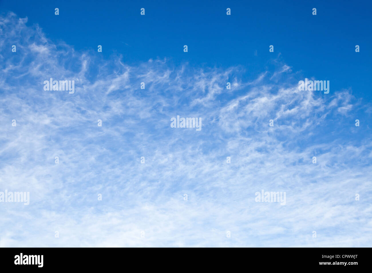 Light windy clouds on the blue sky Stock Photo - Alamy