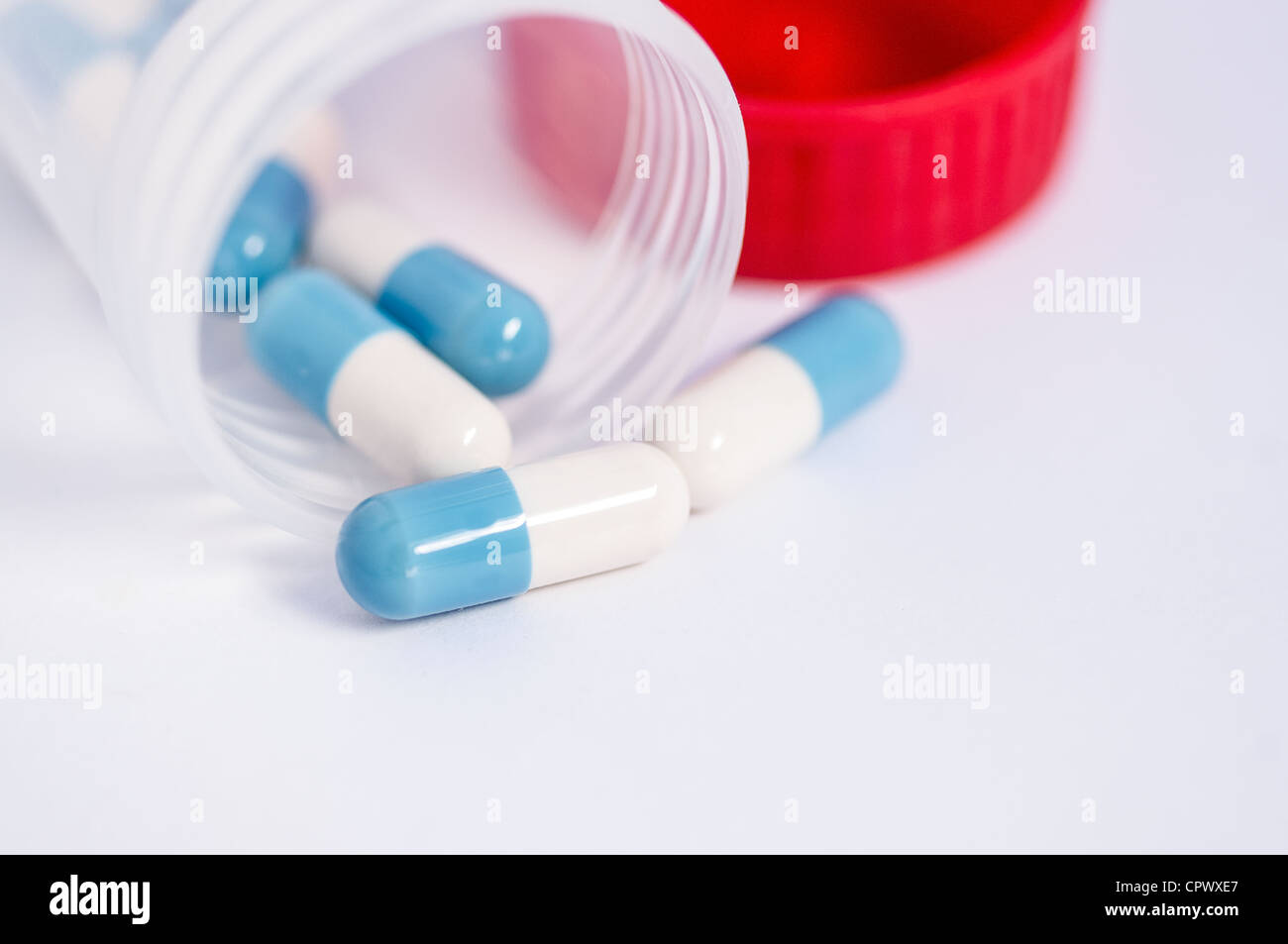 Capsules out of box with great light and colors Stock Photo - Alamy