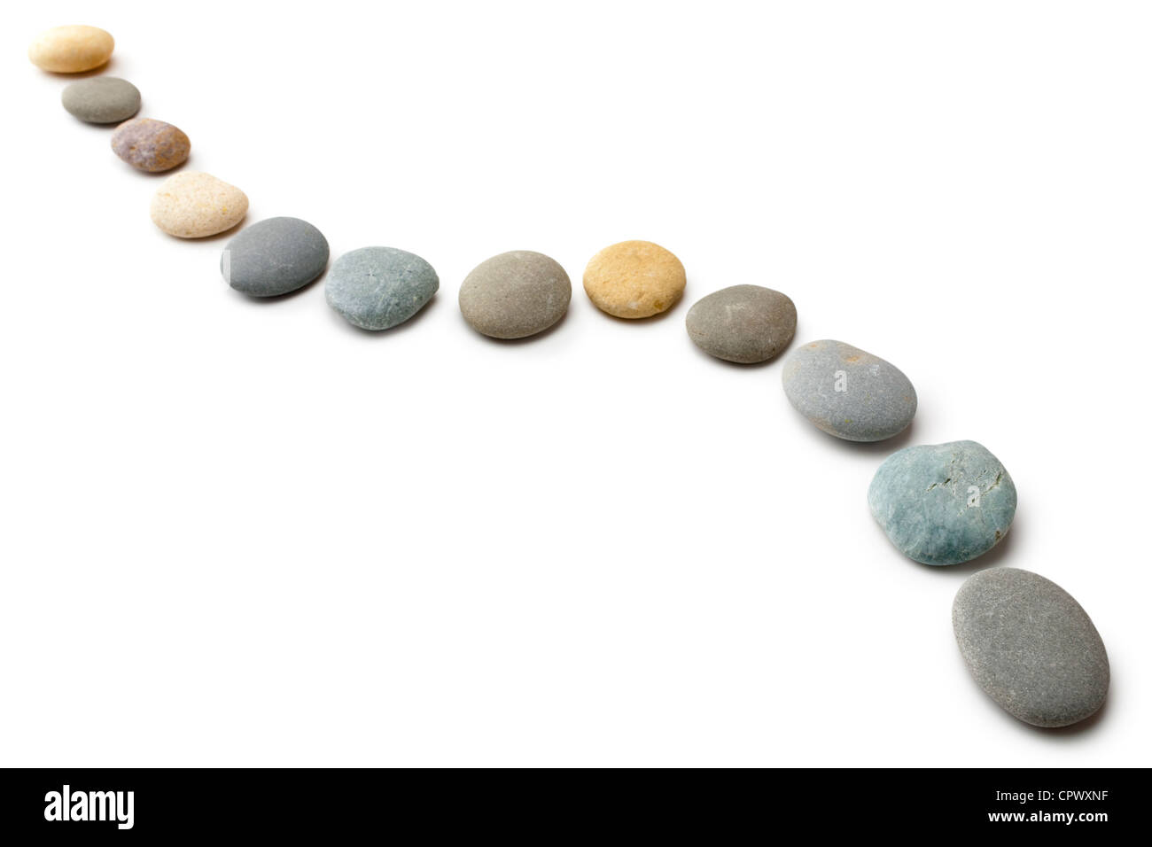 Snaking line of twelve coloured pebbles isolated on white. Clipping ...