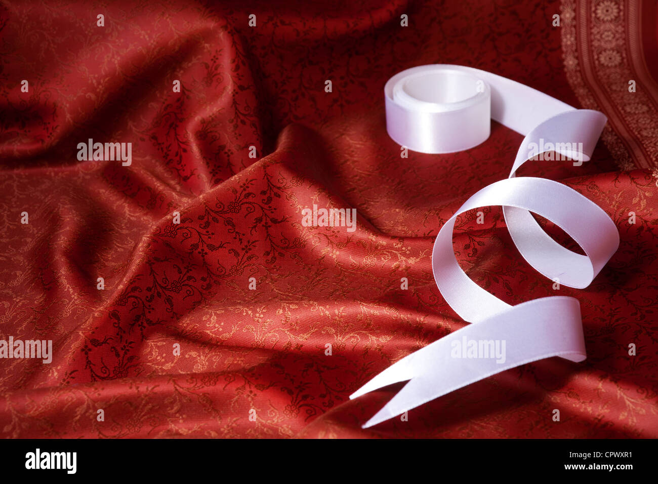 Red beautiful fabric background with white ribbon Stock Photo - Alamy