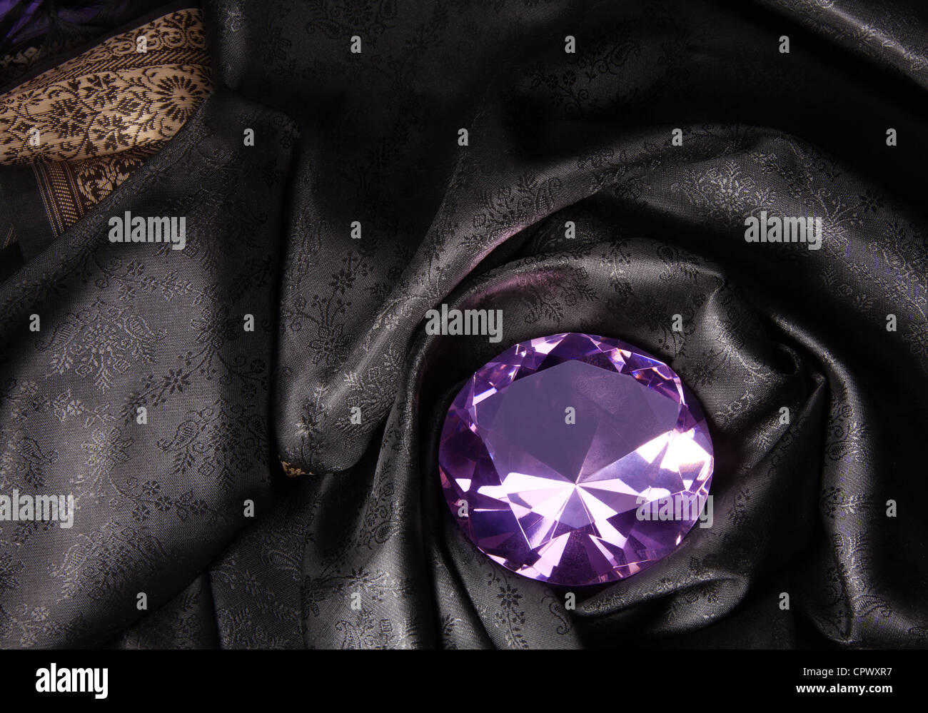 Pink diamond in the black expensive beautiful fabric Stock Photo - Alamy