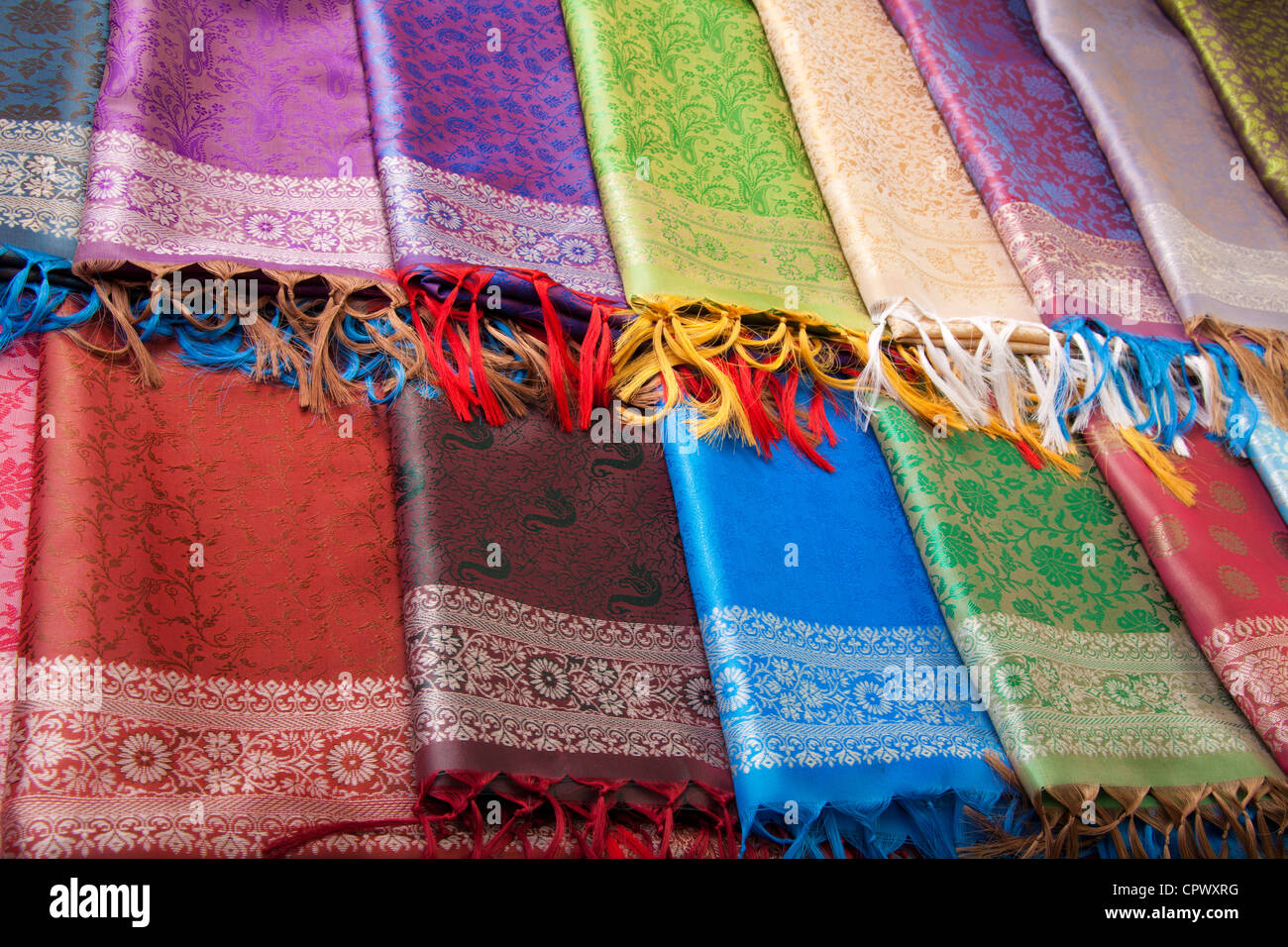 Many different color and texture fabrics on the table Stock Photo - Alamy