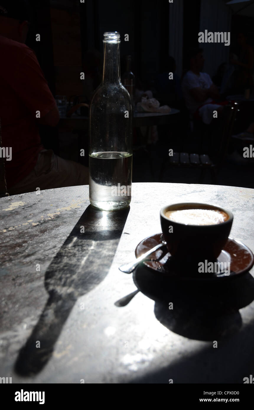 Bottle of water and cup on a table Stock Photo - Alamy