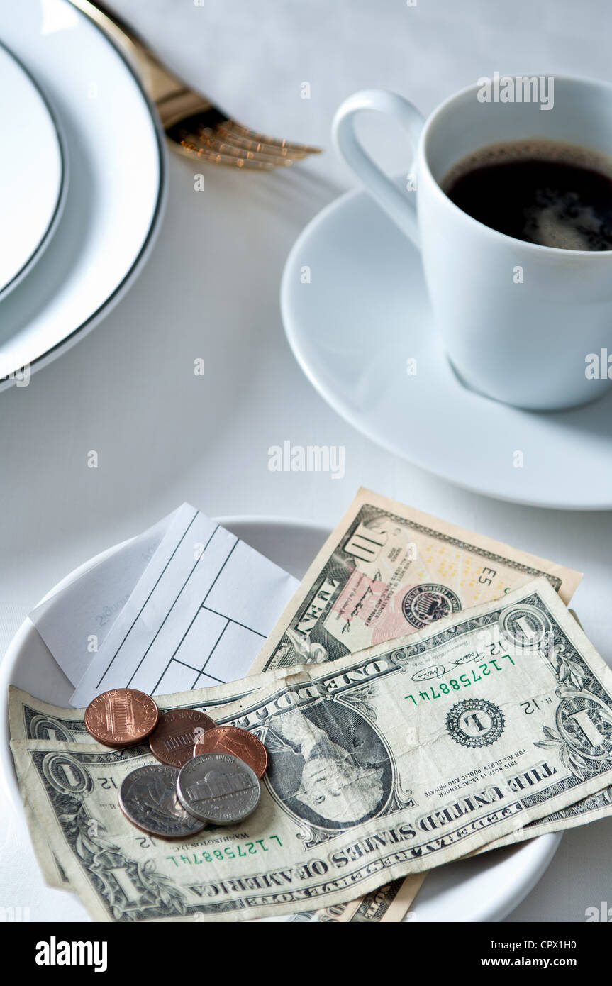 Payment and coffee on restaurant table Stock Photo - Alamy