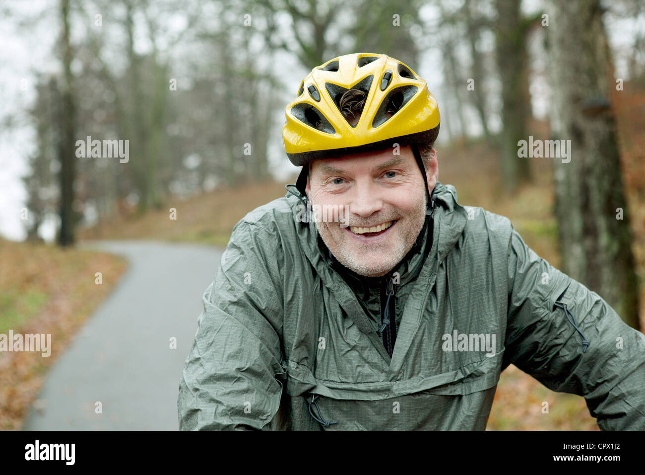 Portrait of mature man on cycle ride Stock Photo - Alamy