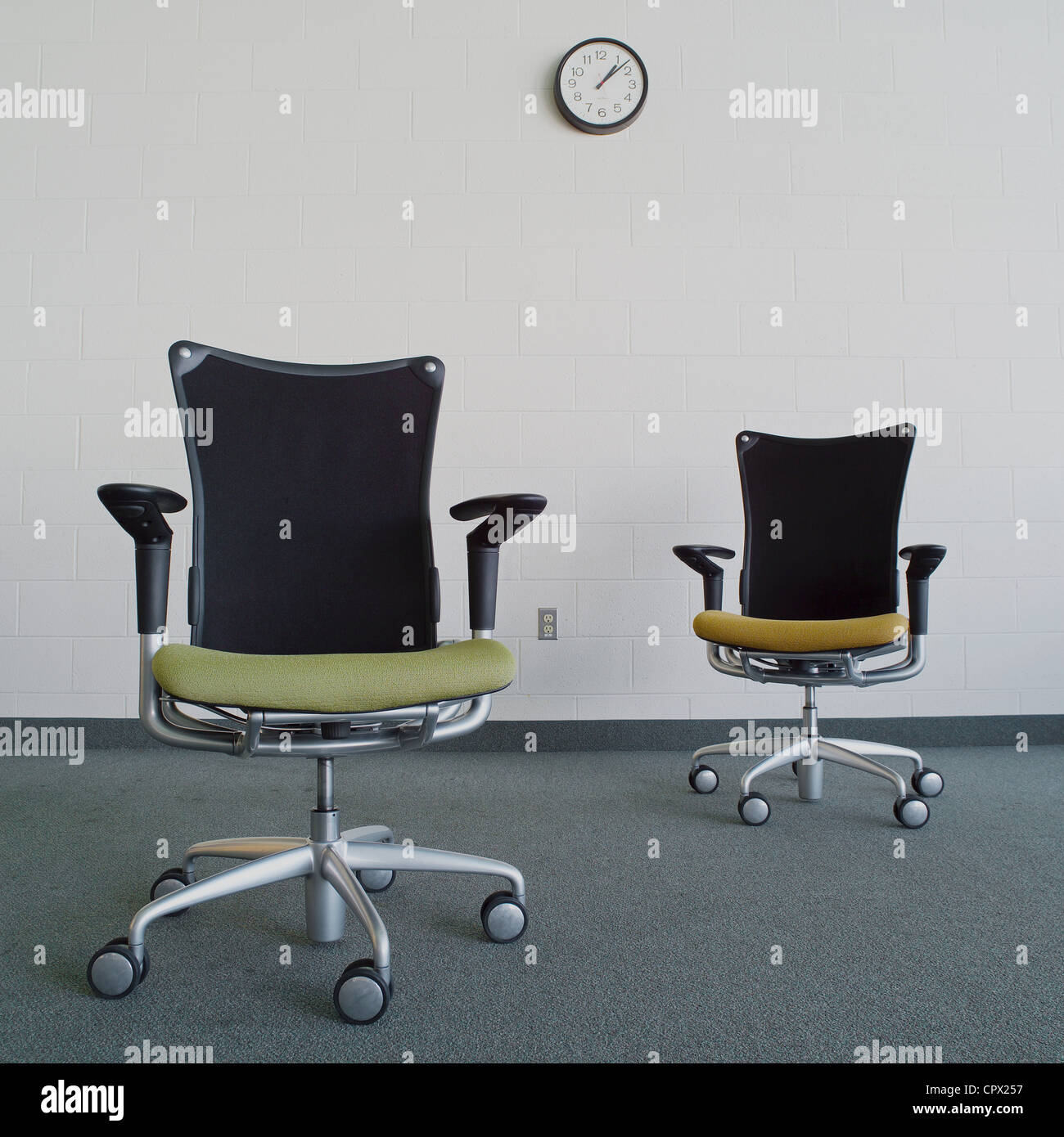Empty office chairs in office Stock Photo - Alamy