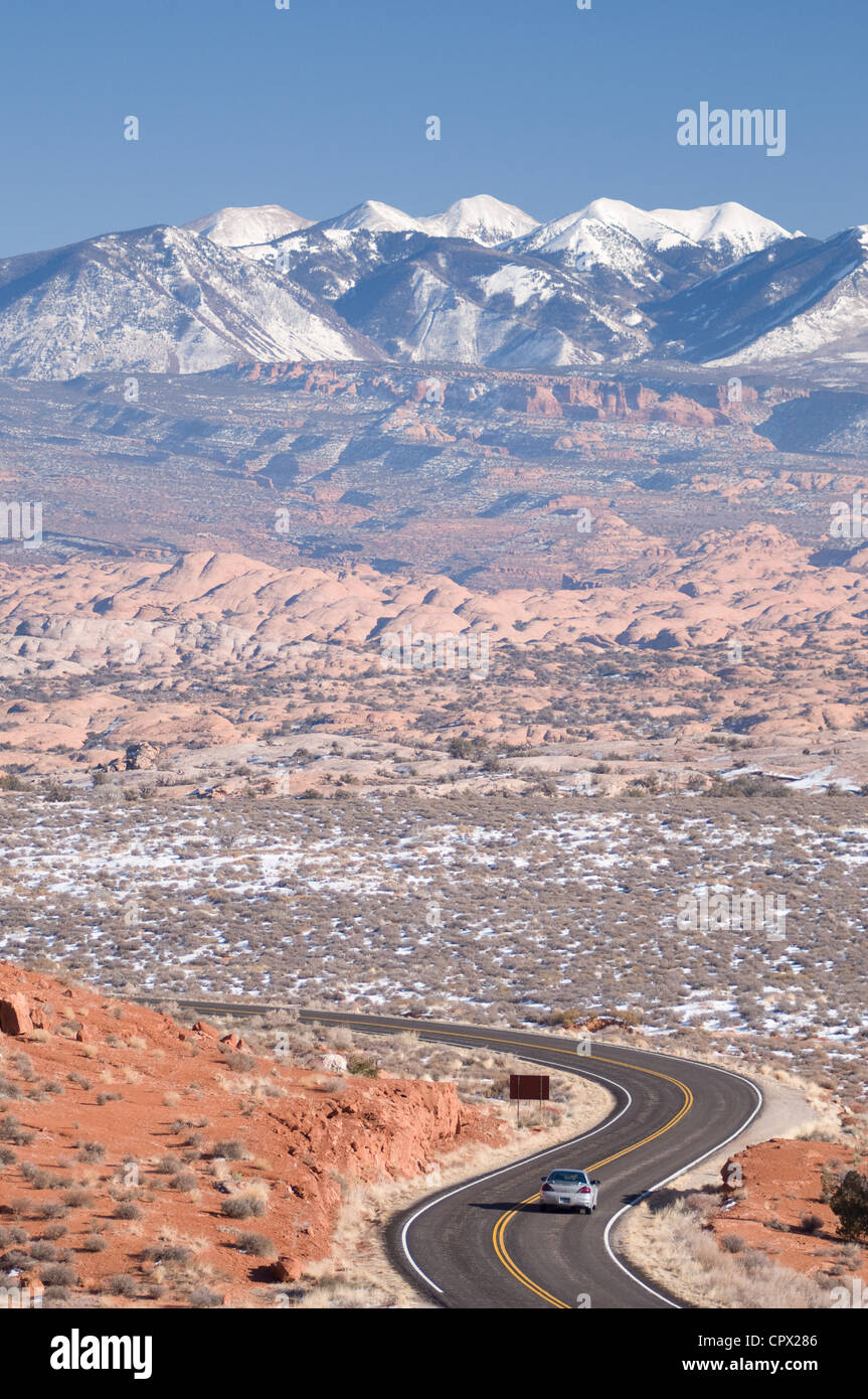 Car on highway in desert, Arches National Park, Utah, USA Stock Photo ...
