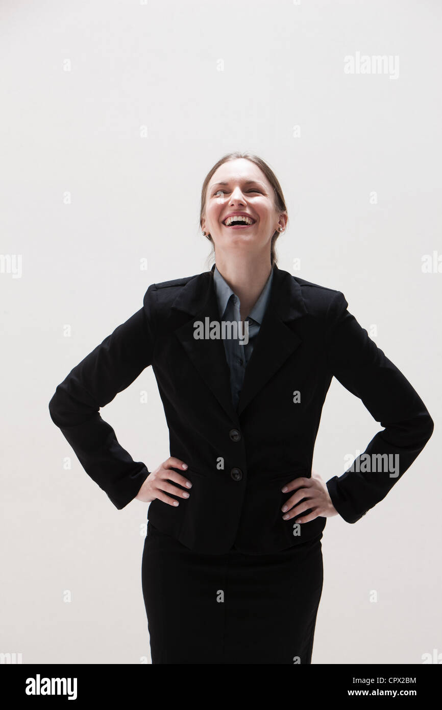 Young businesswoman laughing, studio shot Stock Photo - Alamy