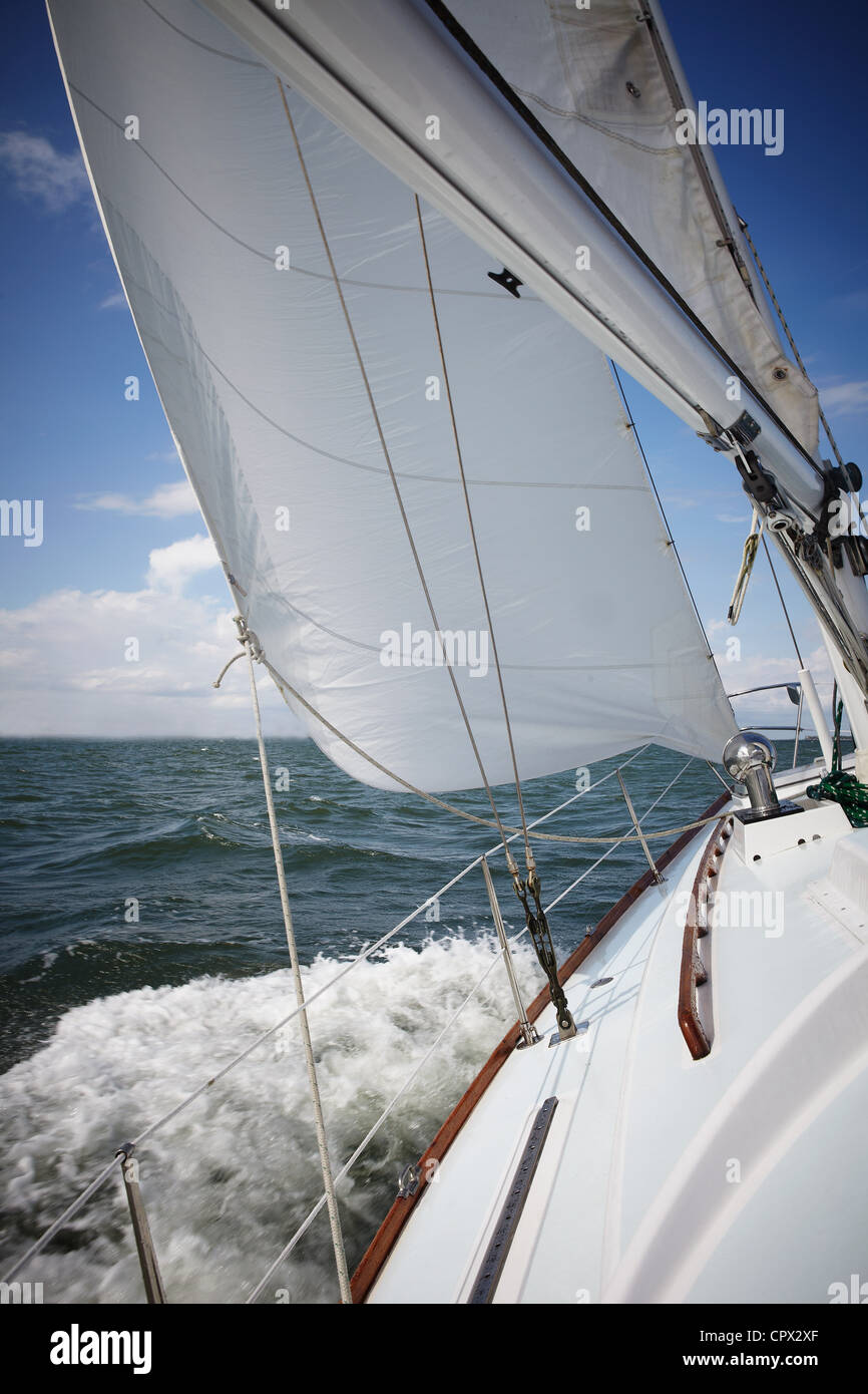 Yacht in sea waves Stock Photo - Alamy