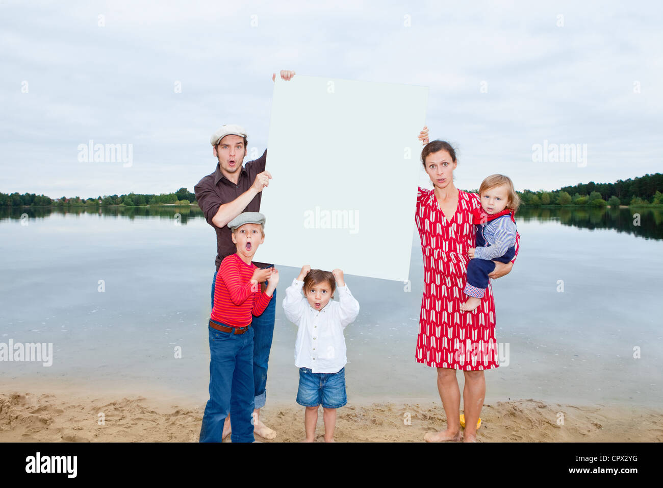 Boy holding blank sign hi-res stock photography and images - Alamy