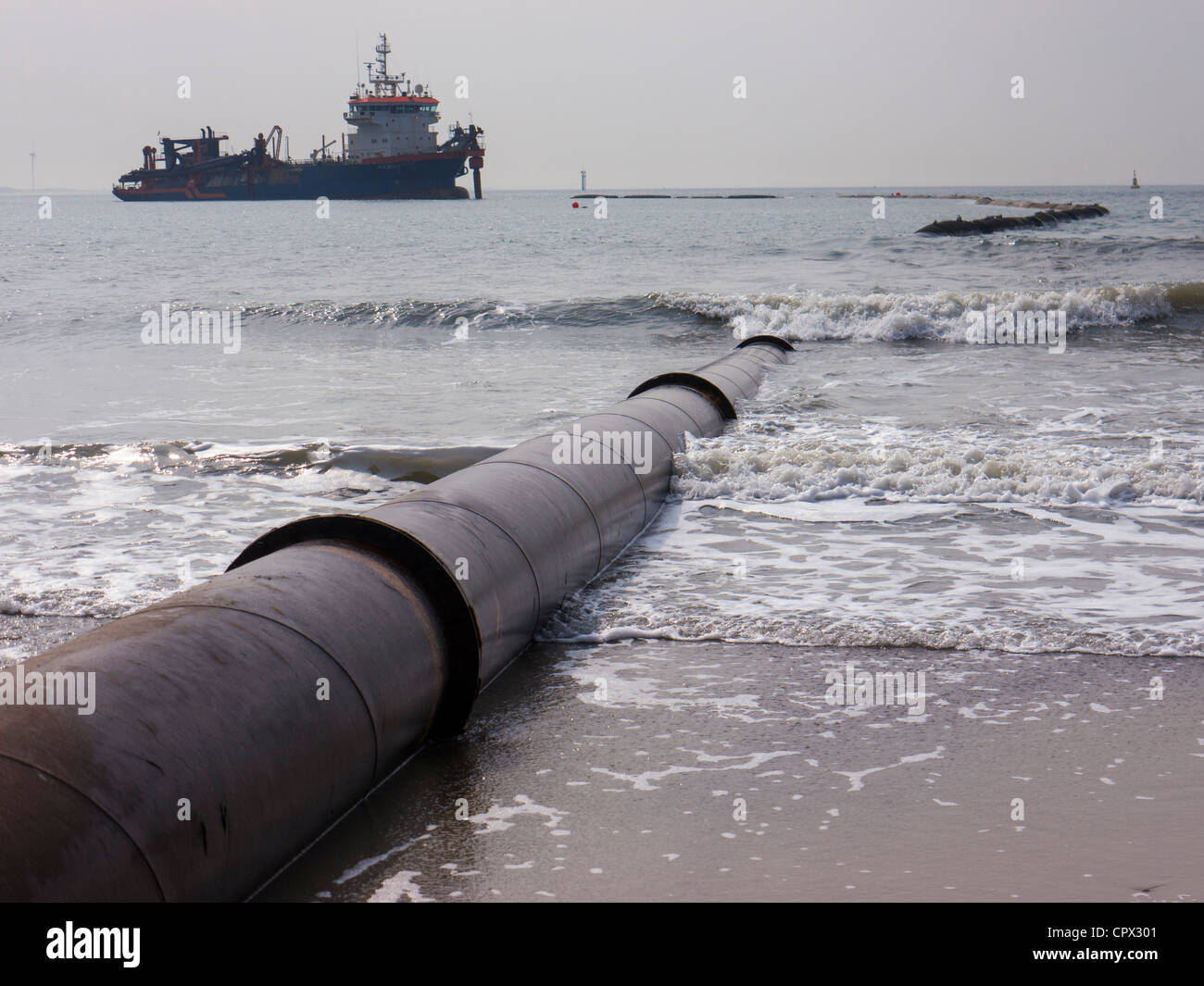 Sand replenishment on a Dutch North Sea beach to prevent coastal ...