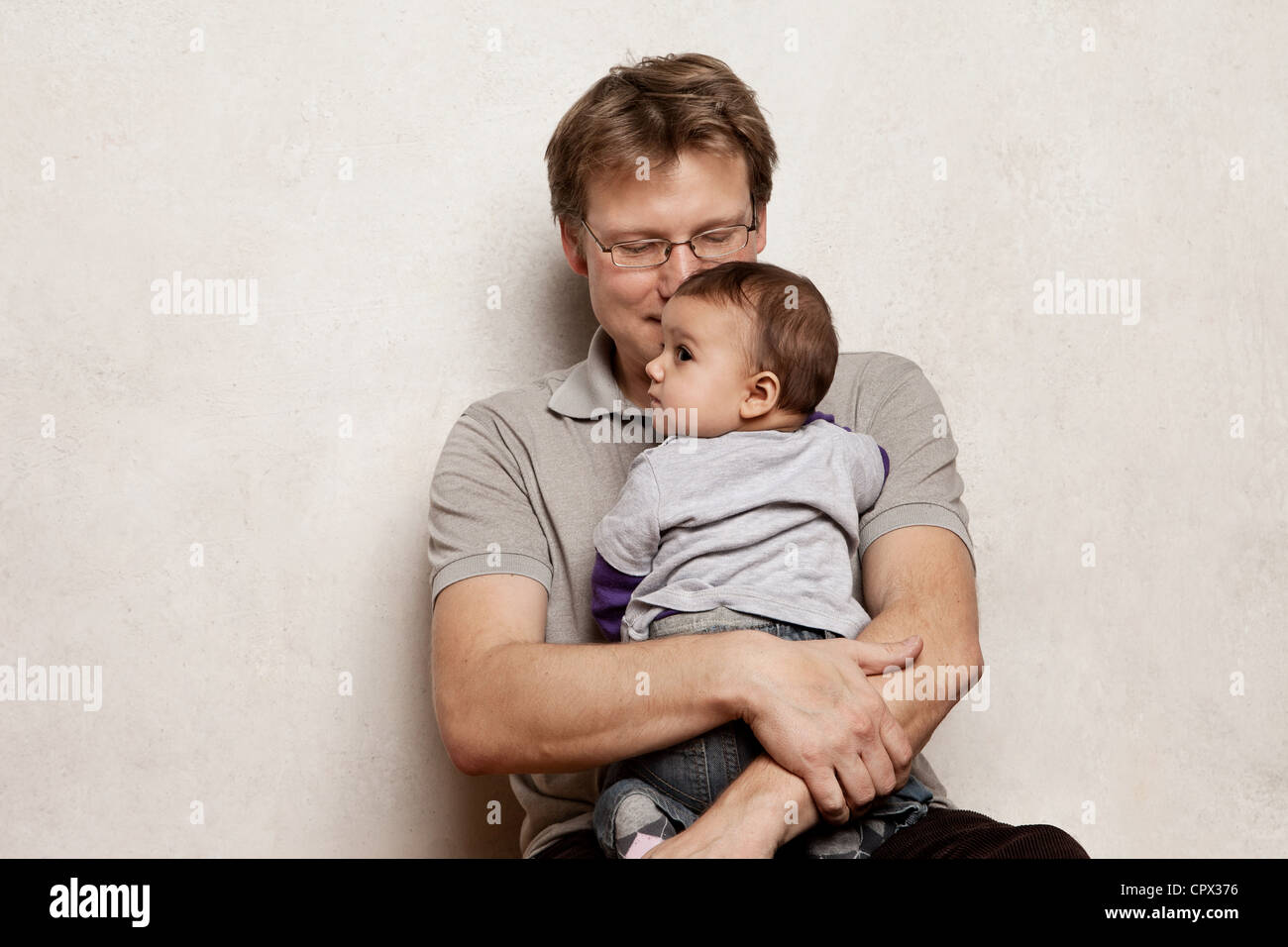 Father holding baby son Stock Photo - Alamy