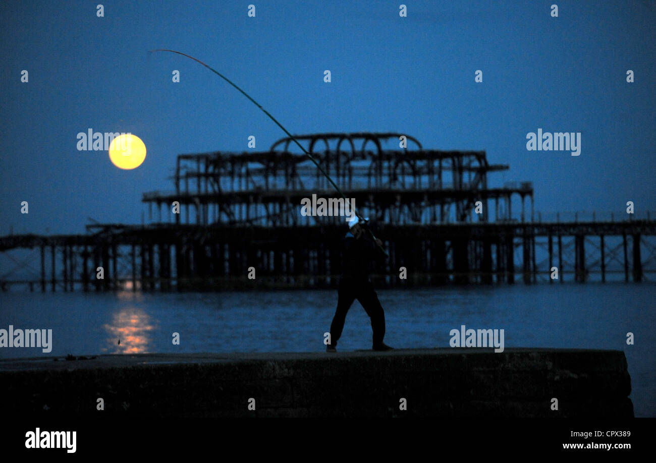 Brighton UK 4 June 2012 - A full moon rises over the West Pier as the ...